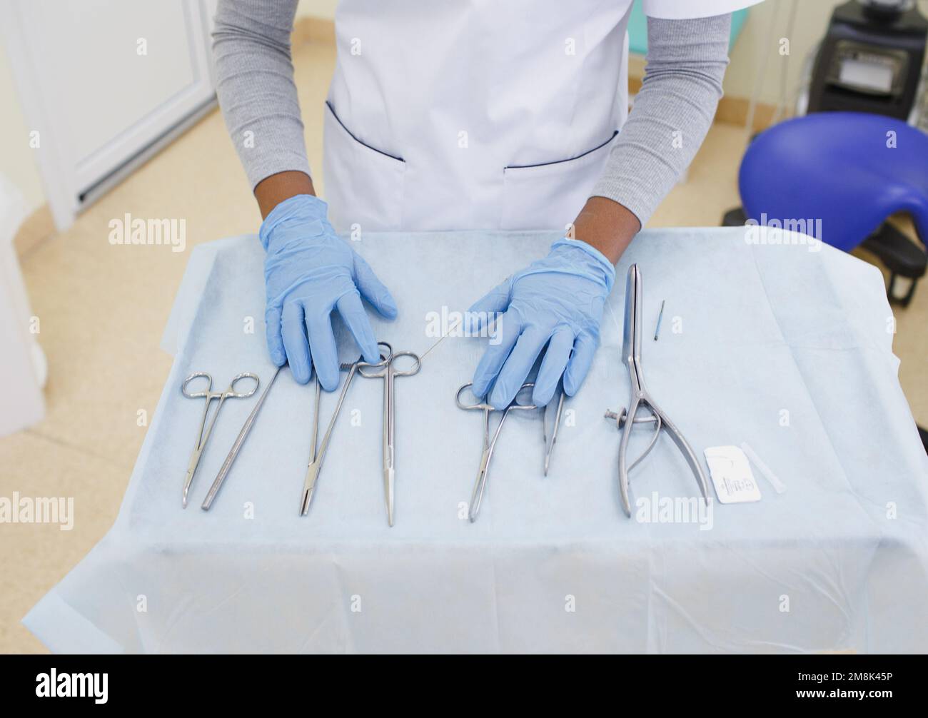 Top view image of an African-American surgeon's hand and surgical ...
