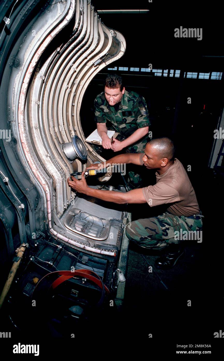 USAF SENIOR MASTER Sergeant Jerry L. McNelly (background), an Air ...