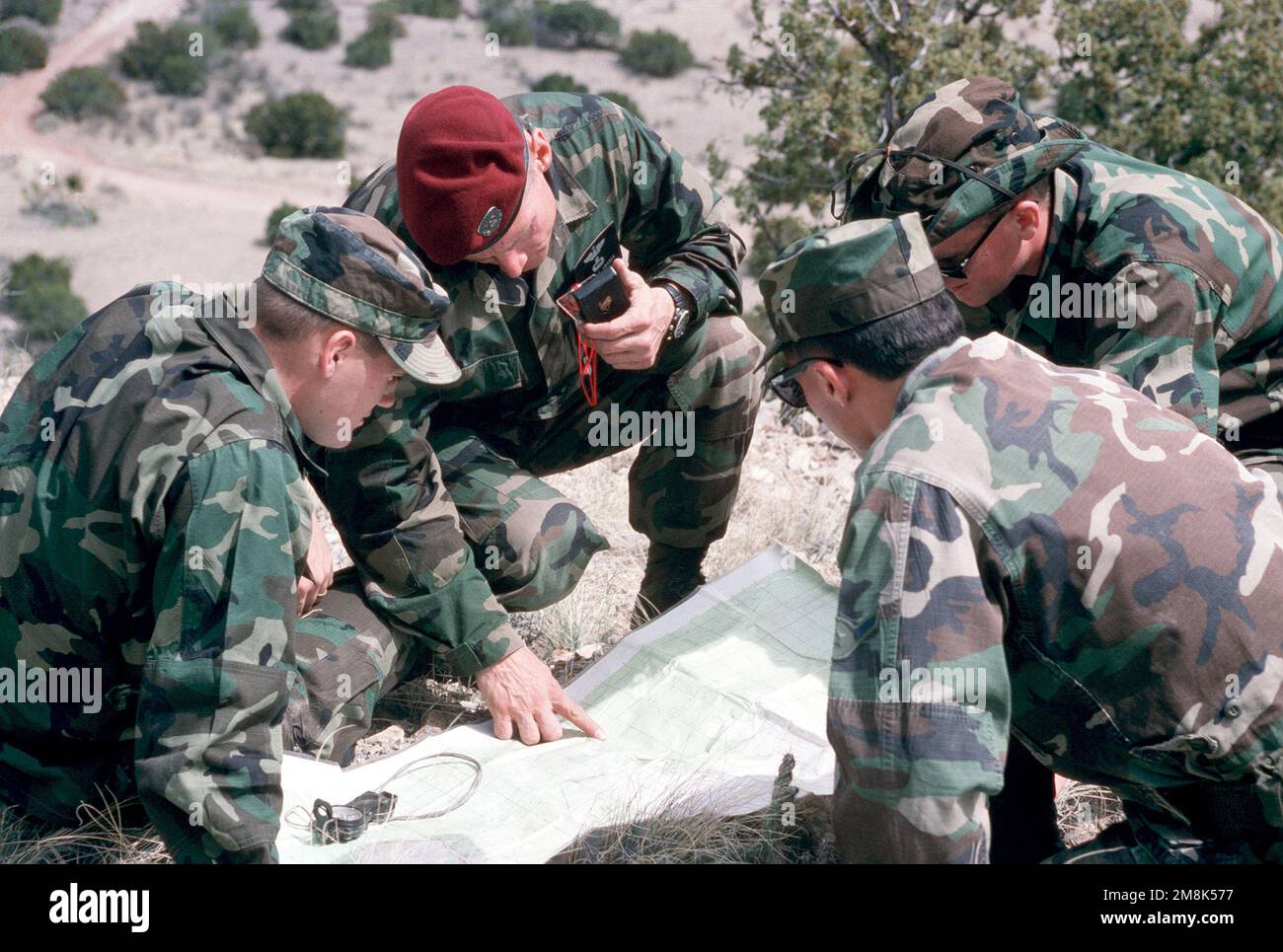 USAF Combat Controllers use a map to pin point landing zone locations ...