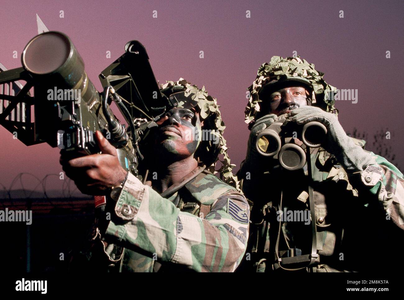 USAF Technical Sergeant Vernon L. Rhodes aims his FIM-92 Stinger ...
