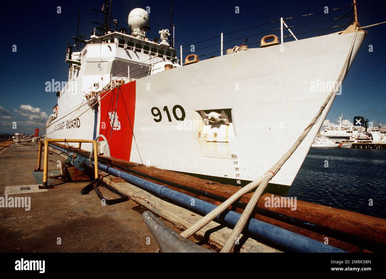 The U.S. Coast Guard Cutter THETIS (WMEC-910) waits pierside for the ...