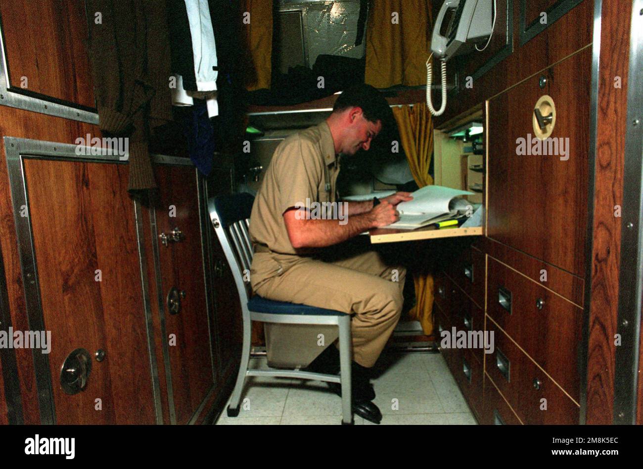An engineering officer on board the nuclear-powered attack submarine ...