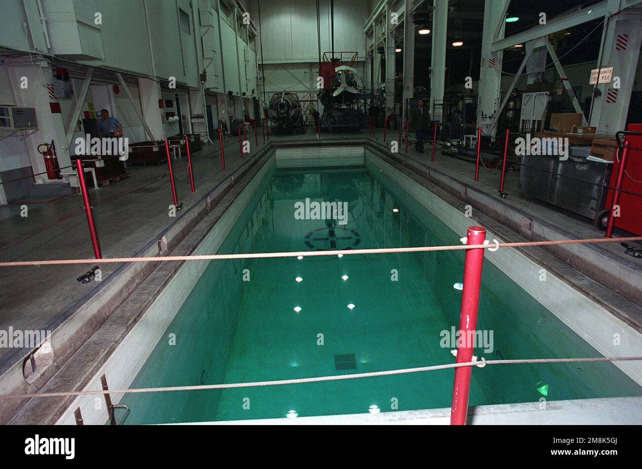 A view inside the Deep Submergence Unit training pool building. In the right rear background is ...