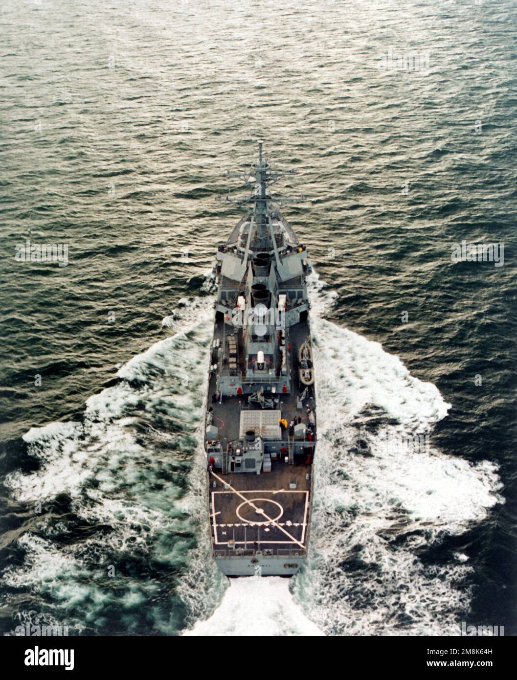 Aerial high oblique stern-on view of the guided missile destroyer USS ...