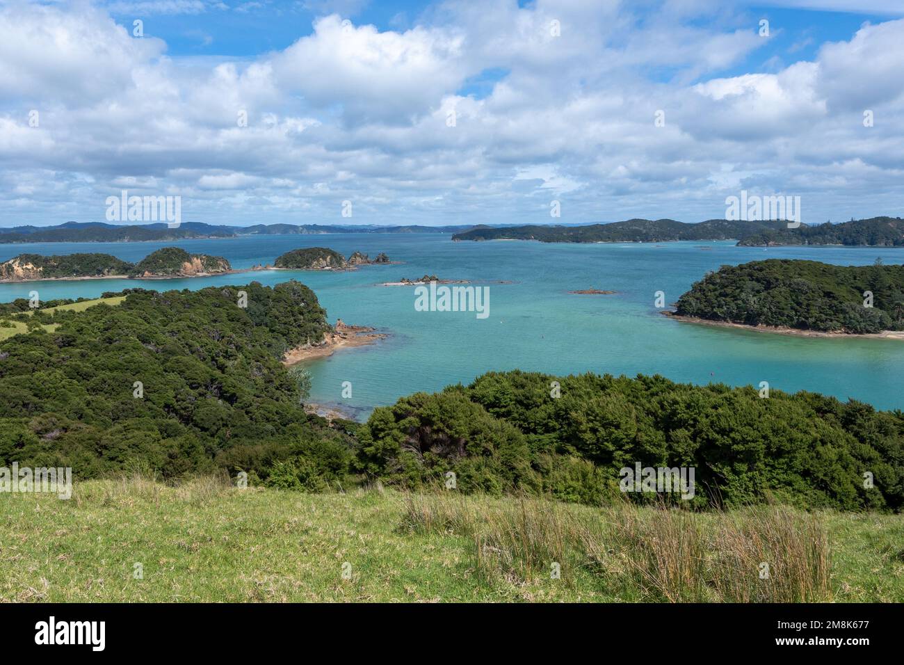 Sunlit Bay of islands with a charming seascape and beach covered with ...
