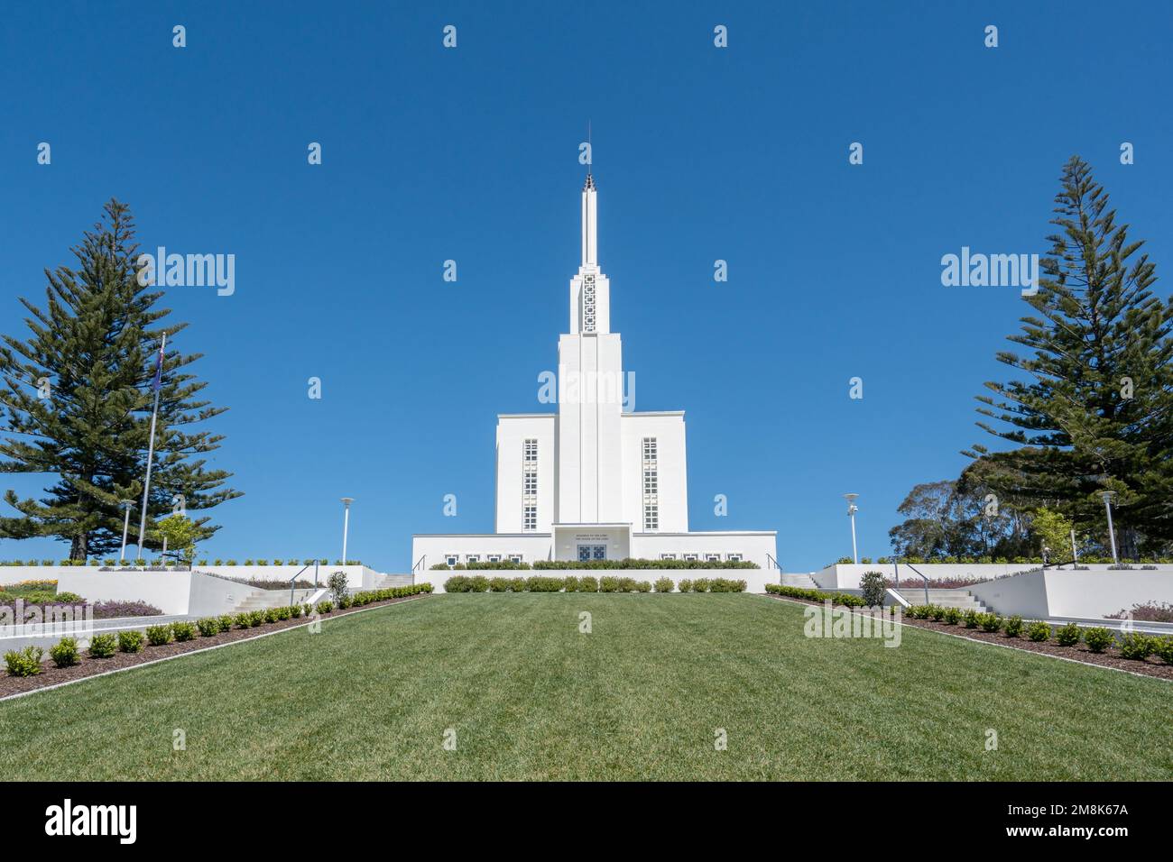 A low-angle of Hamilton New Zealand temple on a sunny day with clear ...