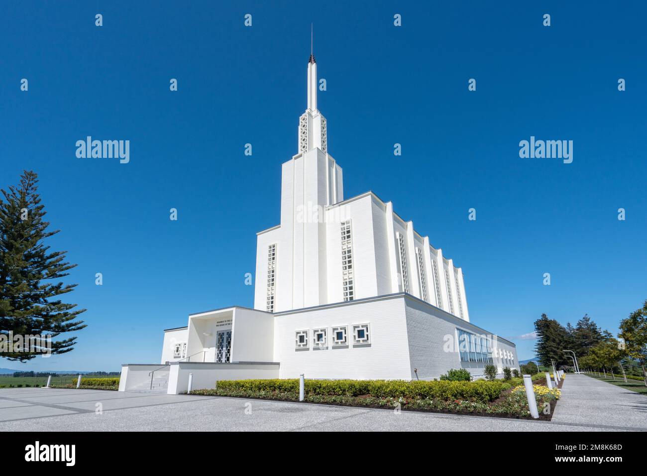 A low-angle of Hamilton New Zealand temple on a sunny day with clear ...