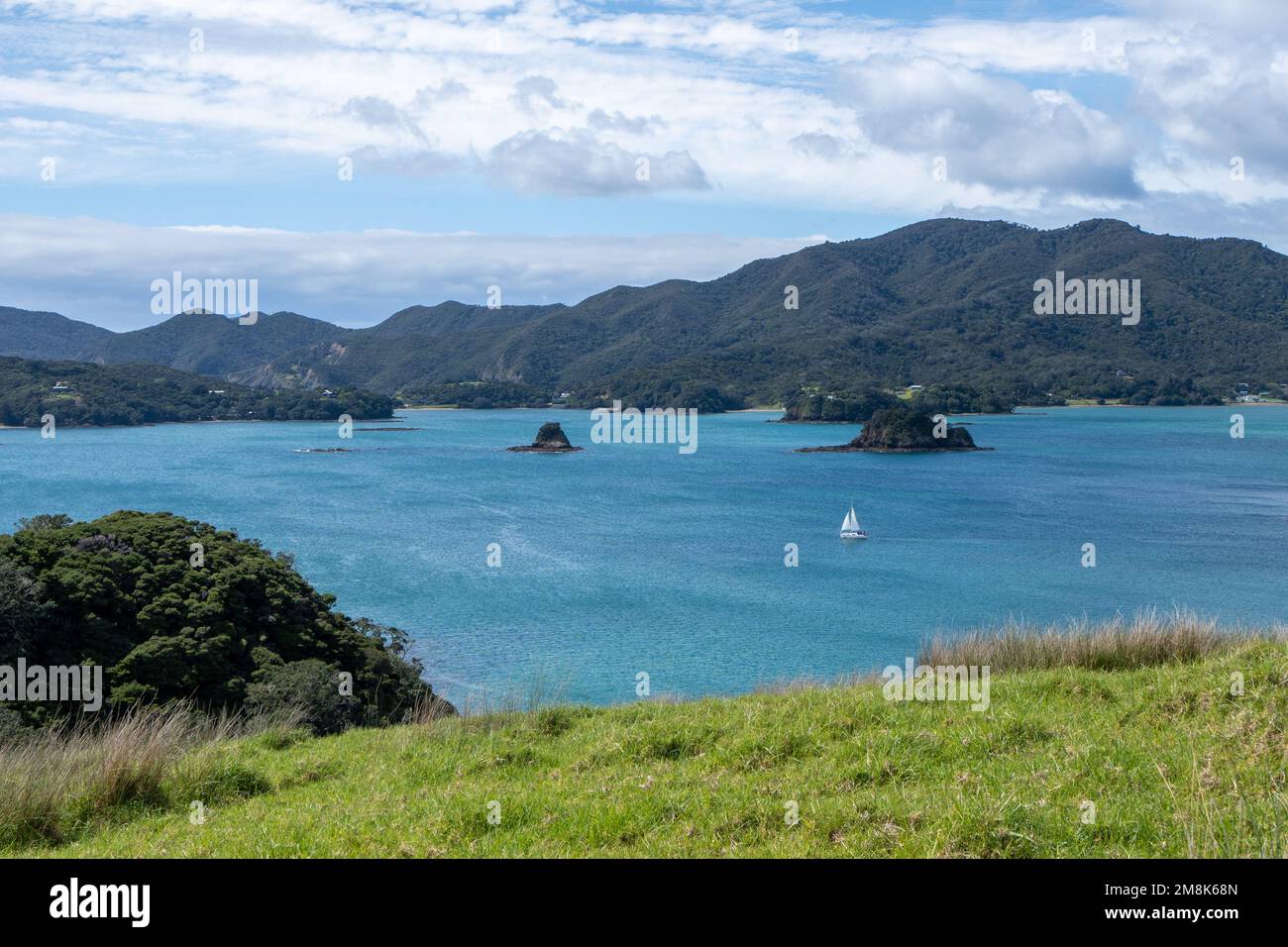 Sunlit Bay of islands with a charming seascape and beach covered with ...