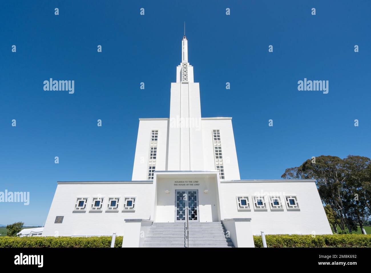 A low-angle of Hamilton New Zealand temple on a sunny day with clear ...