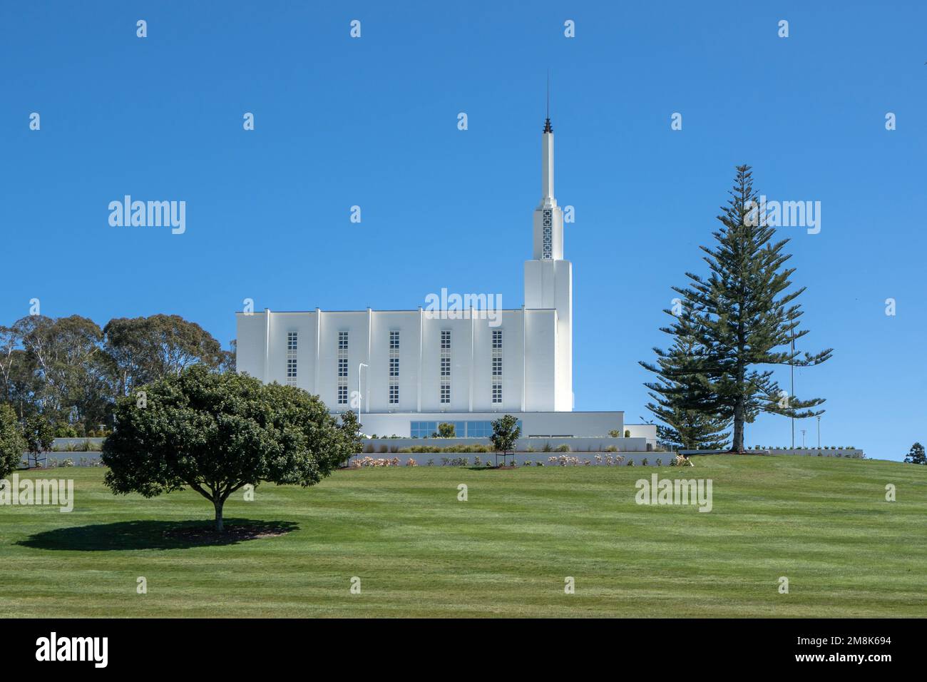 A low-angle of Hamilton New Zealand temple on a sunny day with clear ...