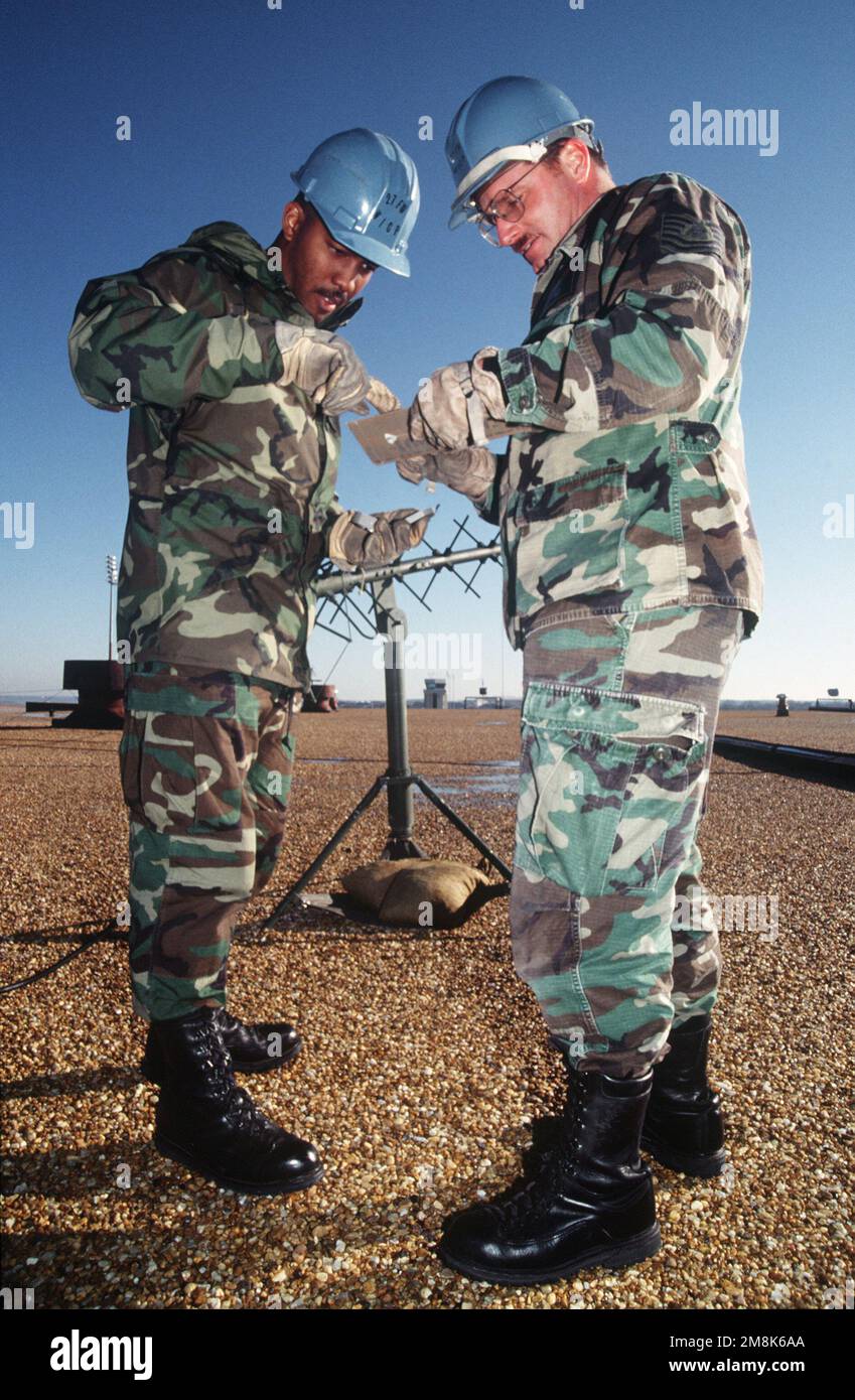 SENIOR AIRMAN Carl Peguese (left) and Technical Sergeant James McLean ...
