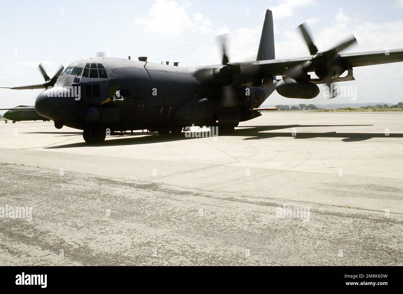 A U.S. Air Force AC-130 Hercules gunship is directed to a parking spot ...