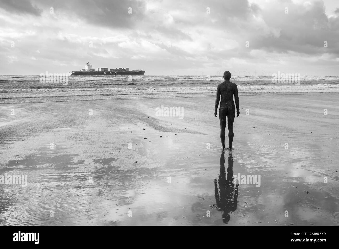 One of the Iron Men at Another Place on Crosby beach near Liverpool ...