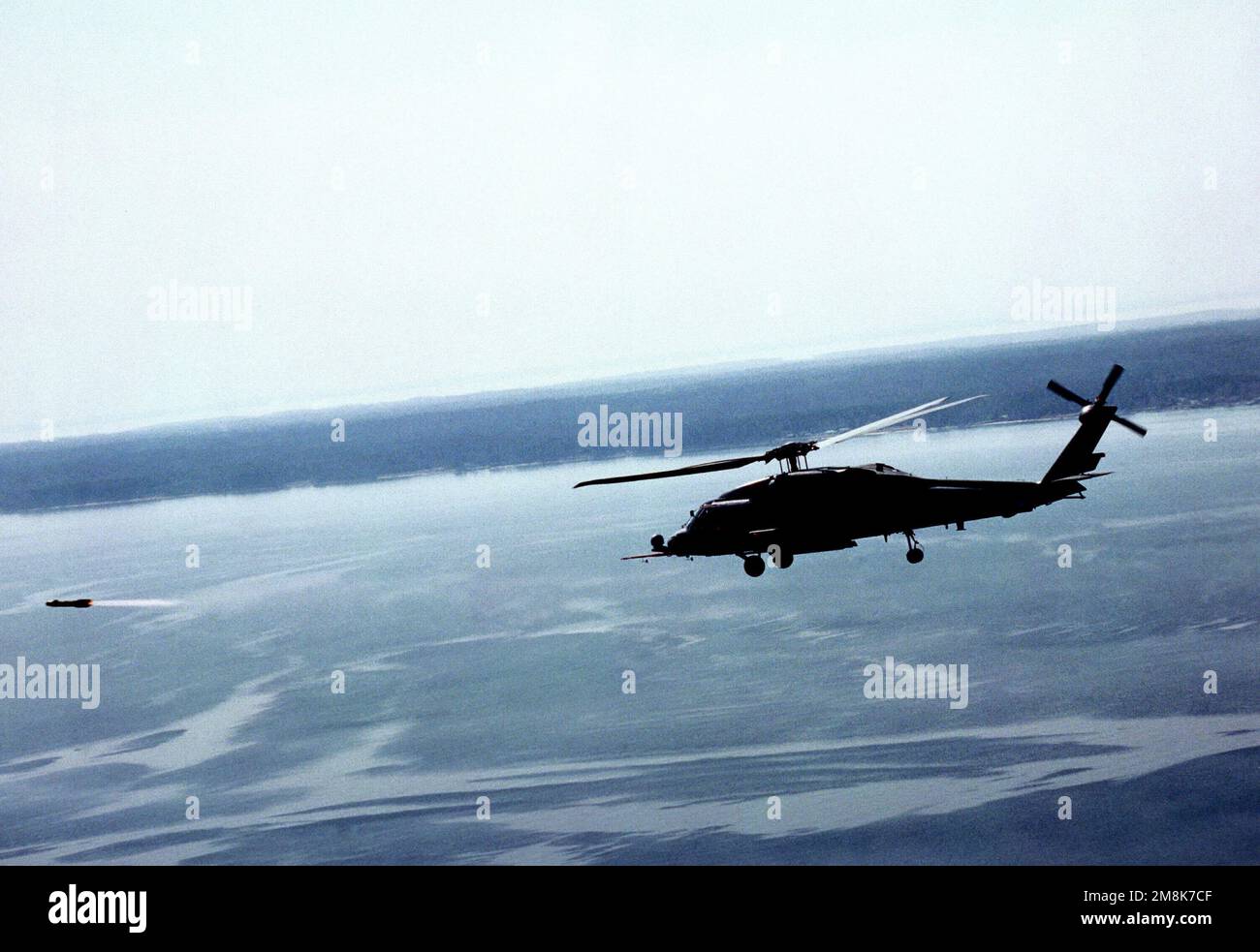 A Hellfire missile speeds toward the target after being launched from a ...