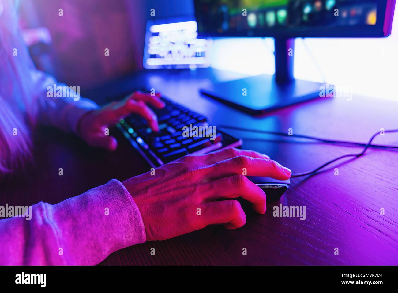 Hands typing keyboard rgb backlight hi-res stock photography and images ...
