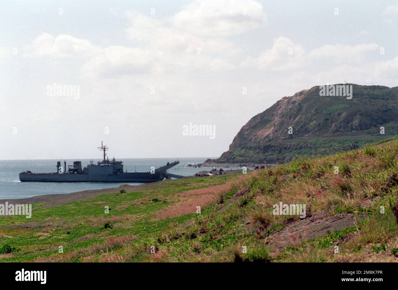 With Mount Suribachi in the background, the tank landing ship USS SAN ...