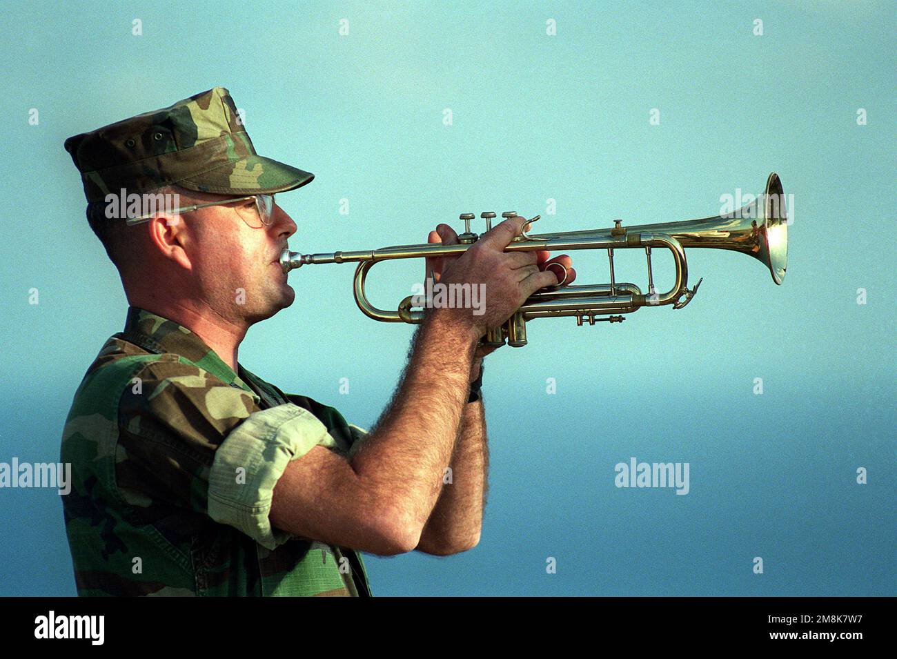 A Marine Corps bugler sounds Taps at the conclusion of memorial ...