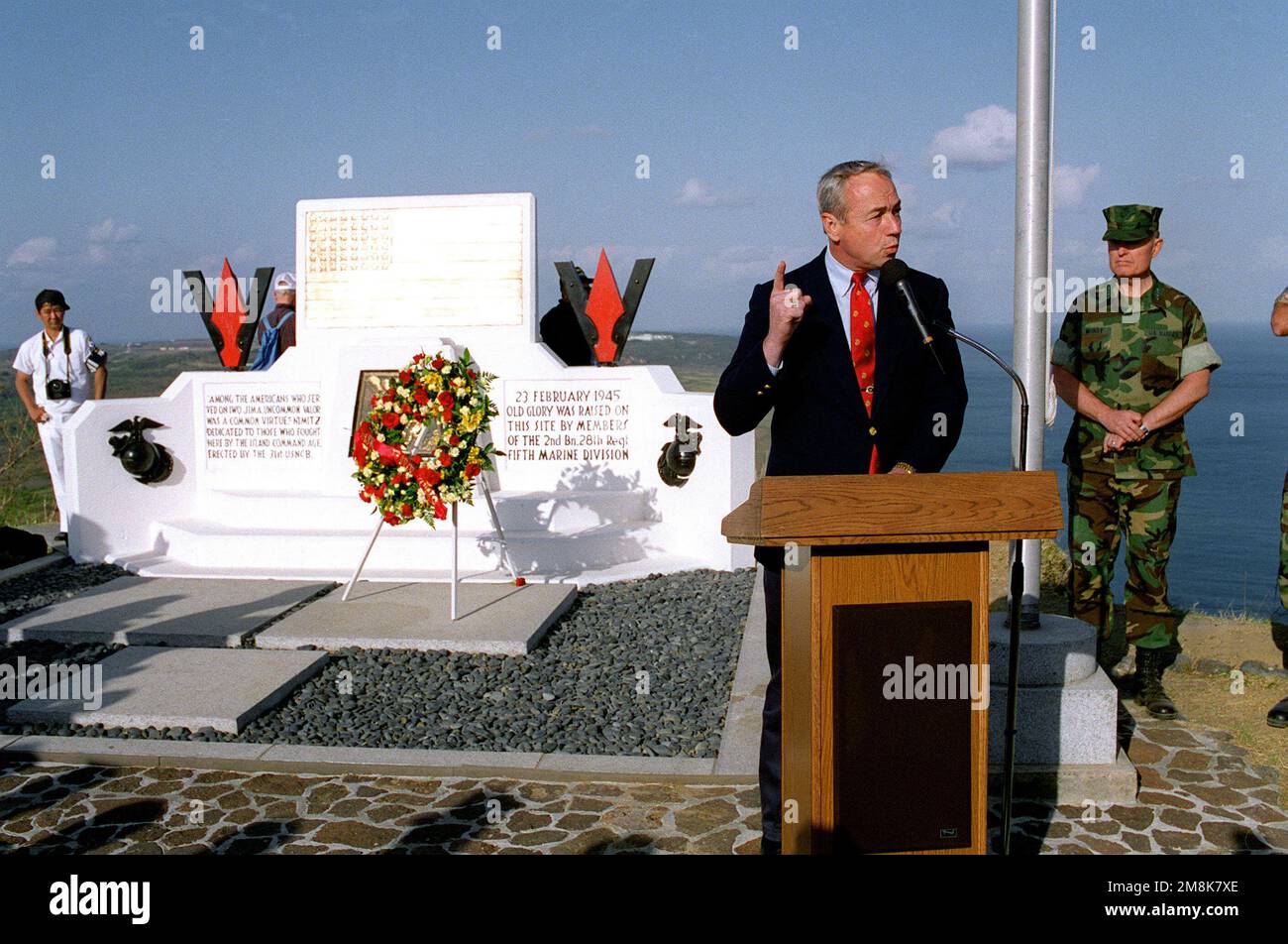 Secretary of the Navy John H. Dalton addresses a large group of active ...