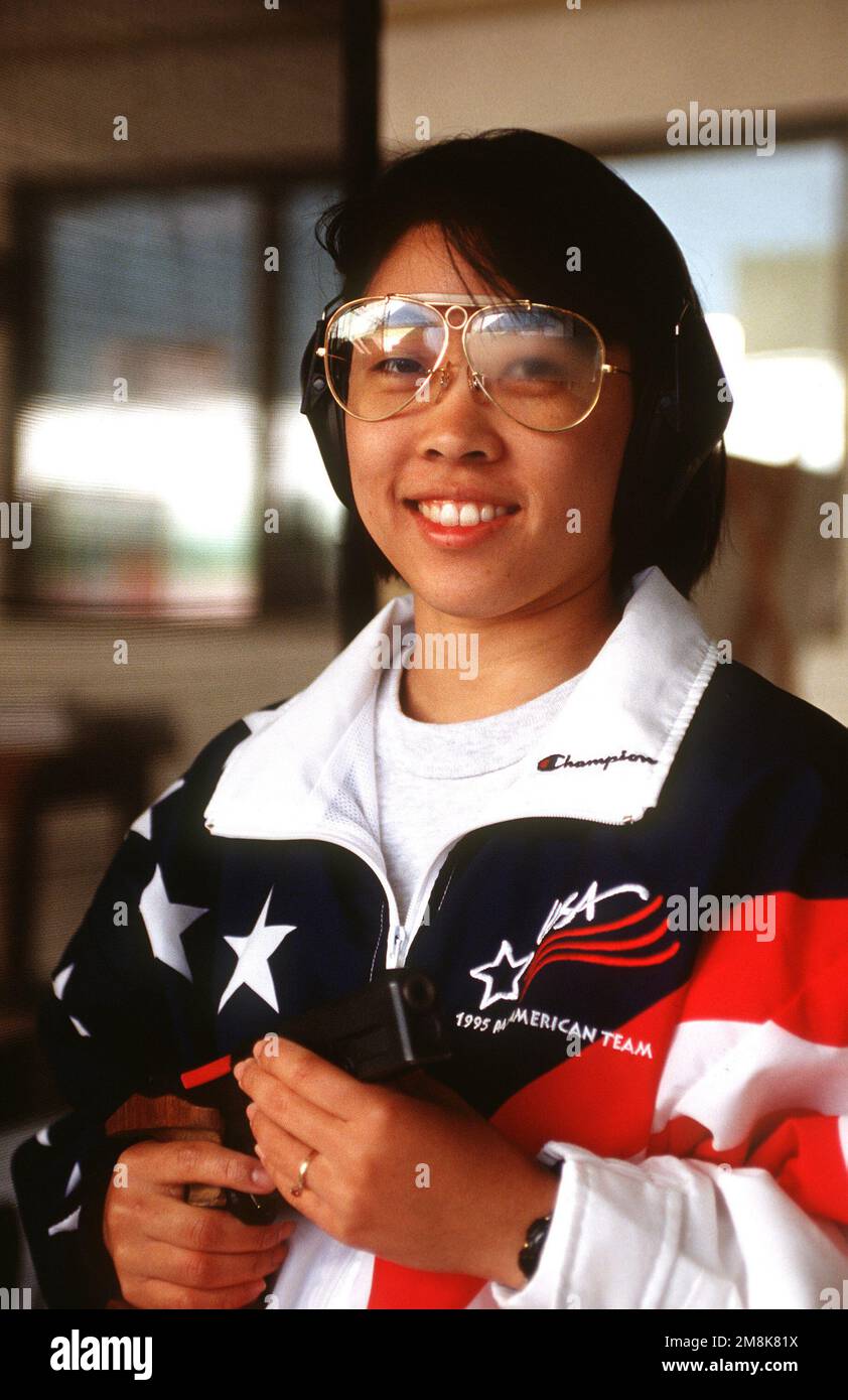 CPL. Sandy Utasy, US Army, poses with her Air Pistol on the range at ...