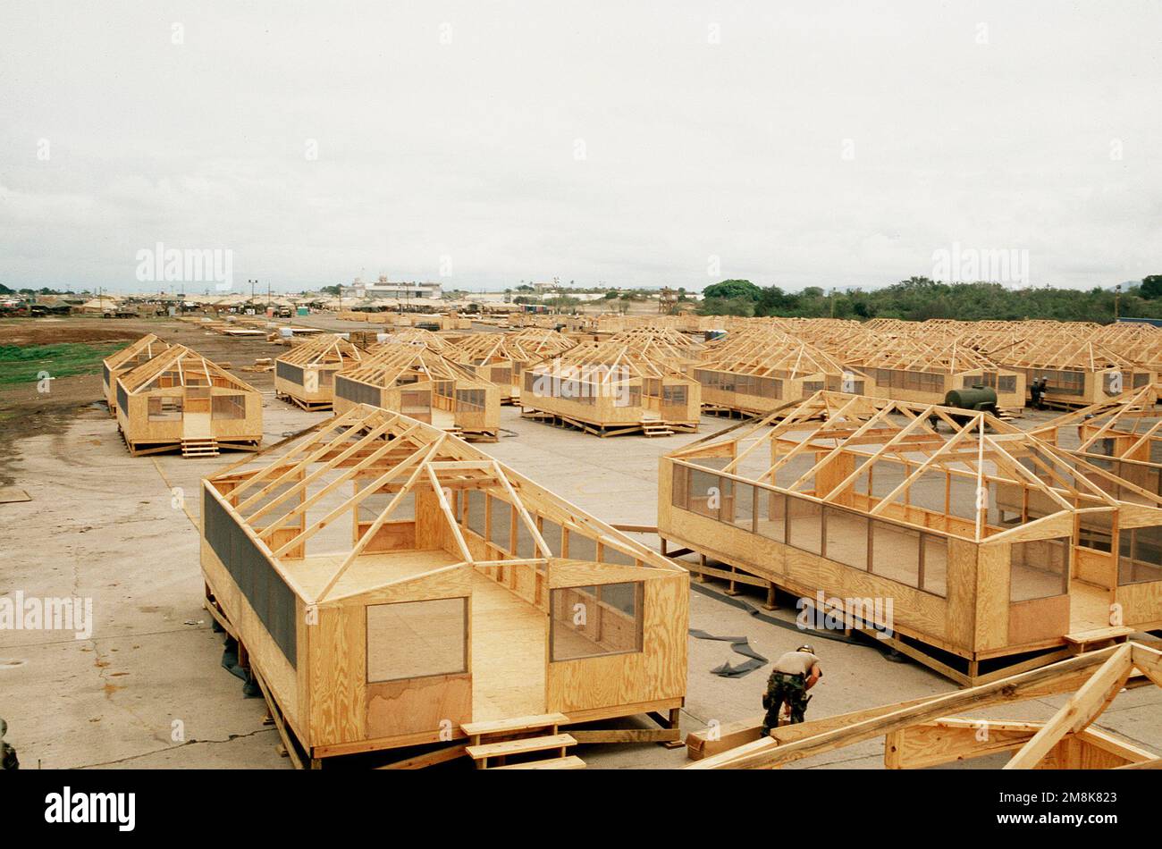 Hard back tent frames are lined up in rows at Camp Five. U.S. Navy ...