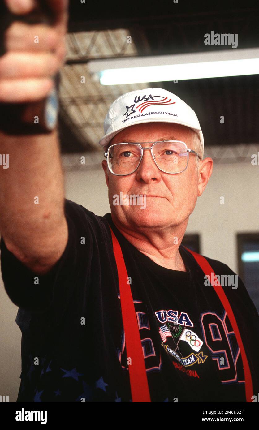 SGT. 1ST Class Darius Young, US Army Reserves, takes aim as he shoots ...
