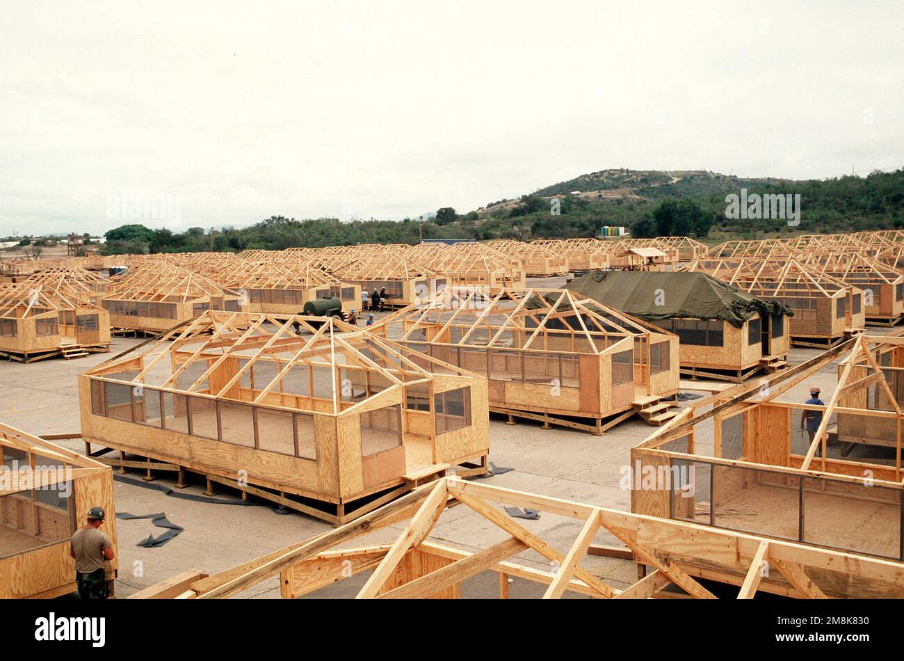 Hard back tent frames are lined up in rows at Camp Five. U.S. Navy ...