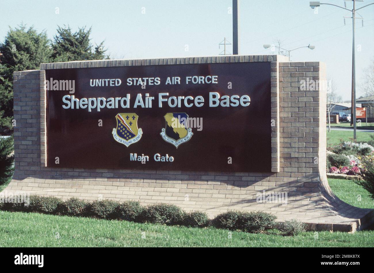 A close-up view of the base sign at the main gate. Base: Sheppard Air ...