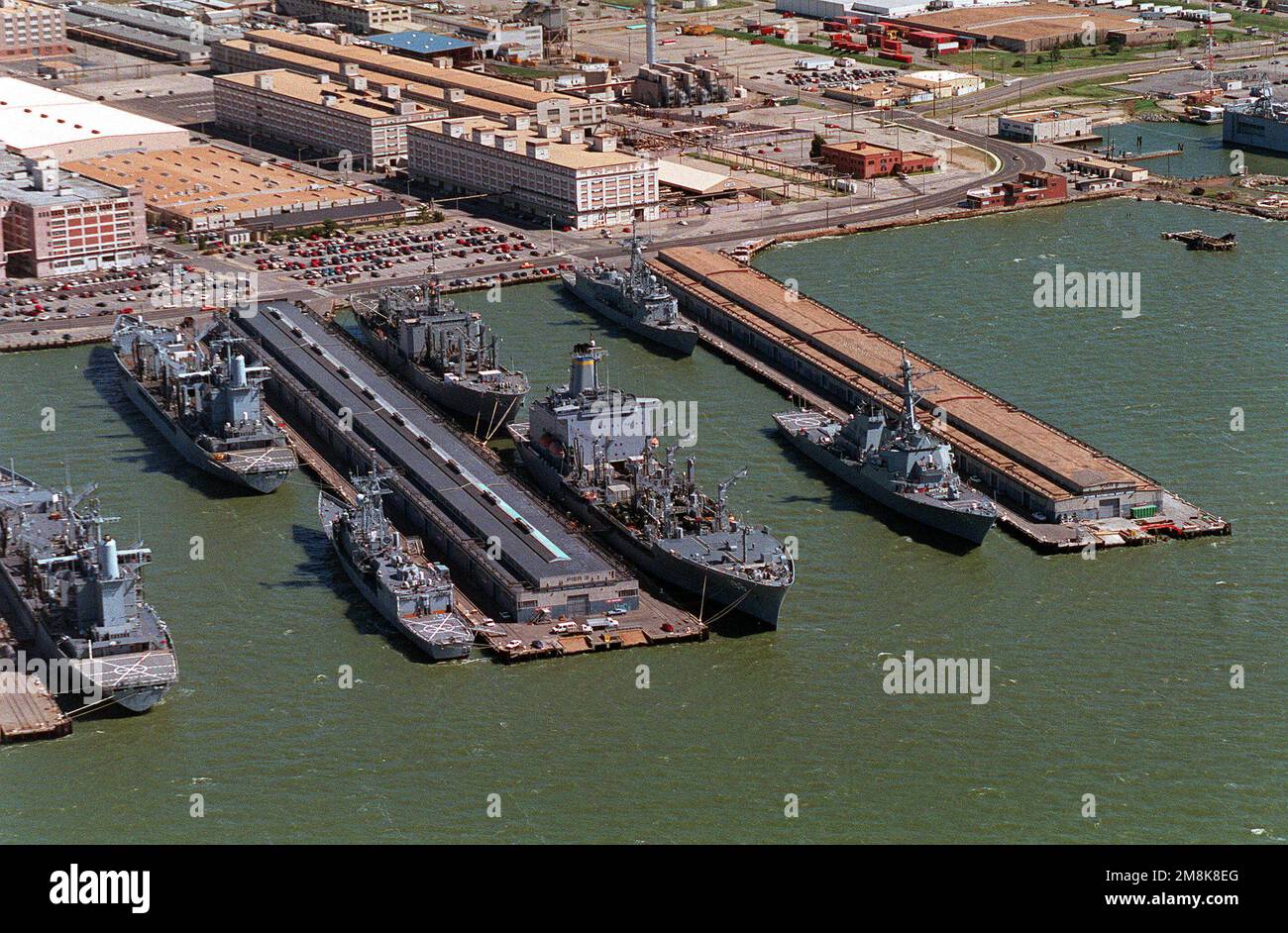 An aerial view of part of the Norfolk Naval Station showing pier one ...