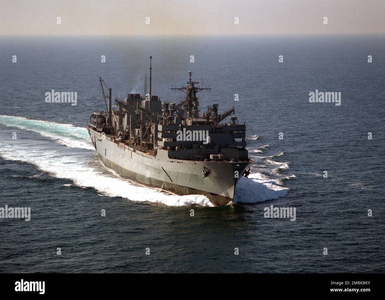 An aerial port bow view of the fast combat support ship USS ARCTIC (AOE ...
