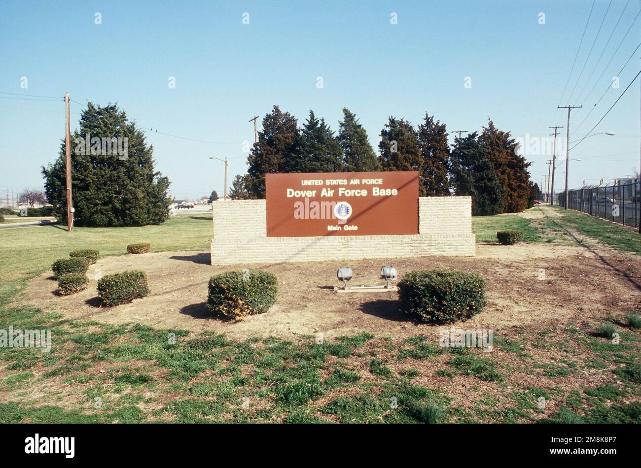 A close-up view of the base sign at the main gate. Base: Dover Air ...