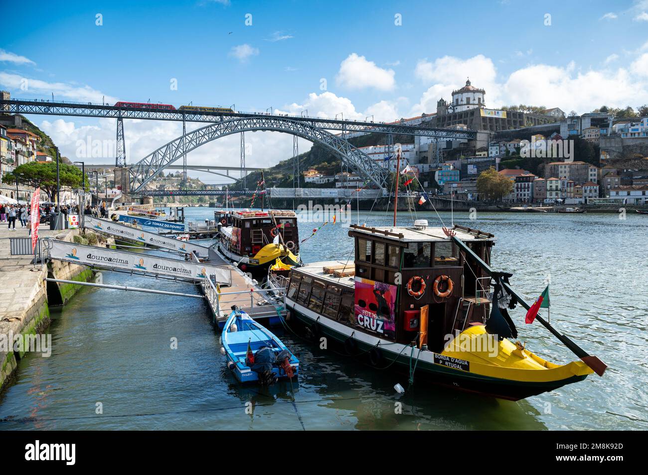 Boats on the Douro river port with bridges in the background Stock ...