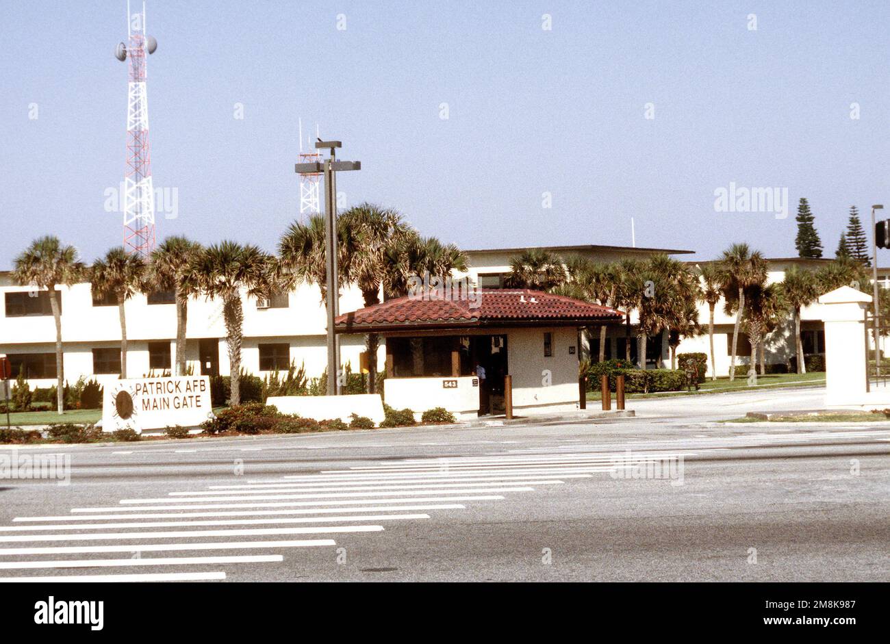 A long-range view of the main gate and base sign at the entrance. Base ...