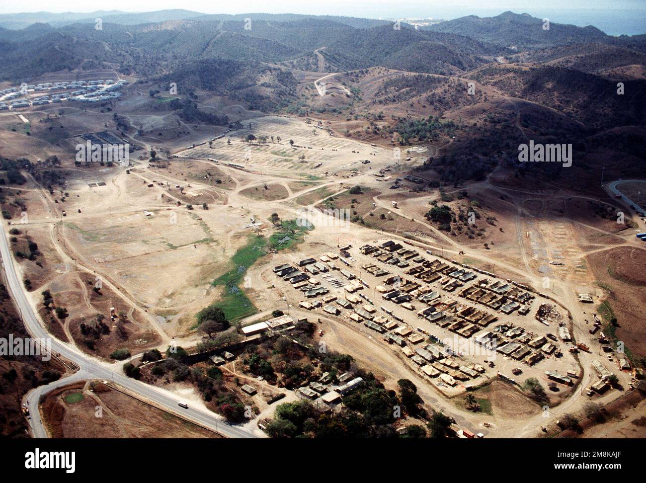 Aerial of the remains at the golf course camps. All migrants have been ...