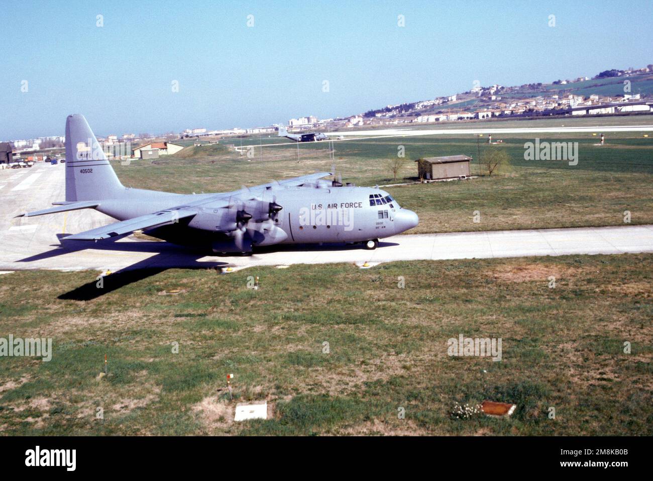 A U.S. Air Force C-130 Hercules taxis down the ramp at Falconar Airport ...