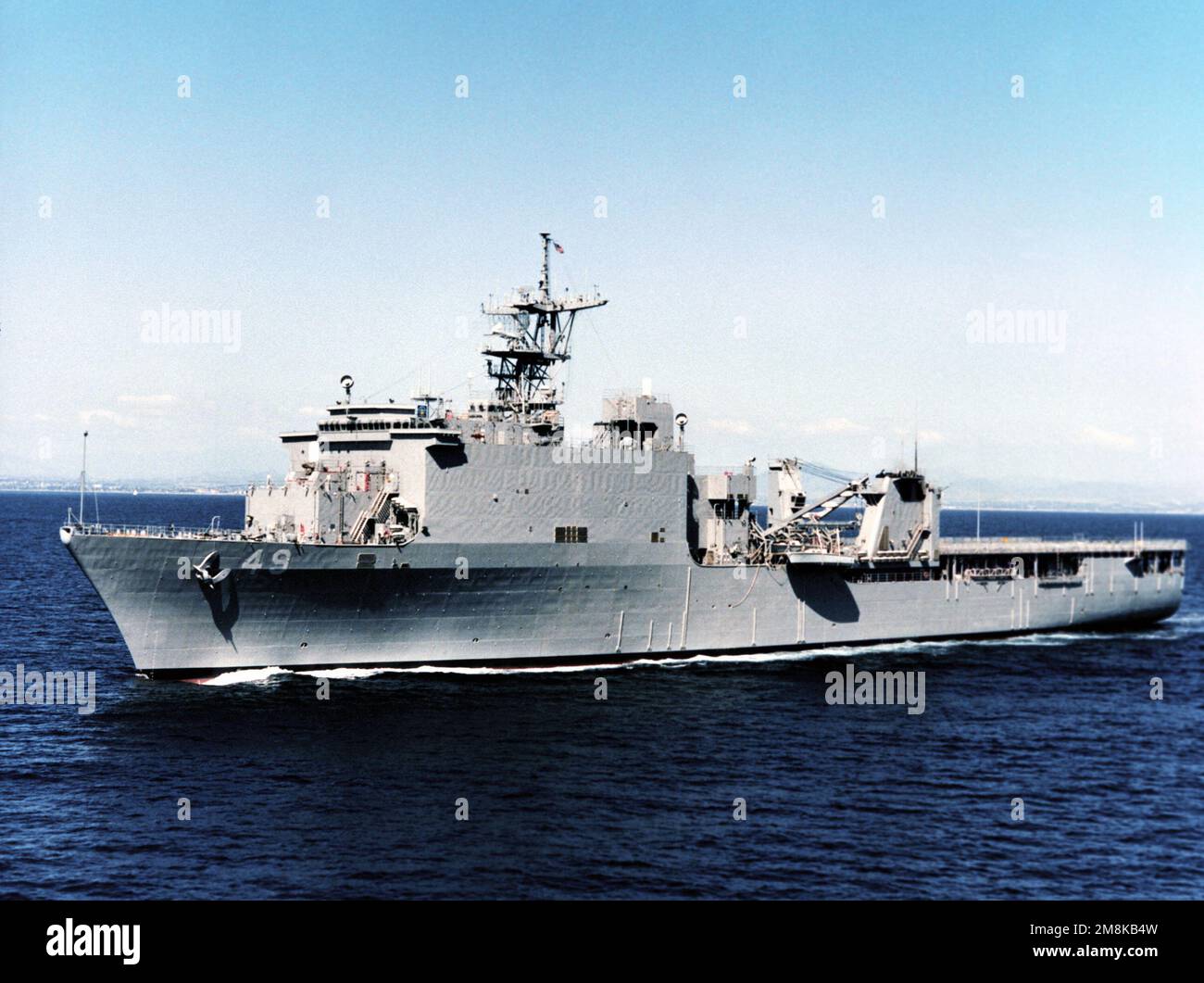 Low oblique port bow view of the dock landing ship USS HARPERS FERRY ...