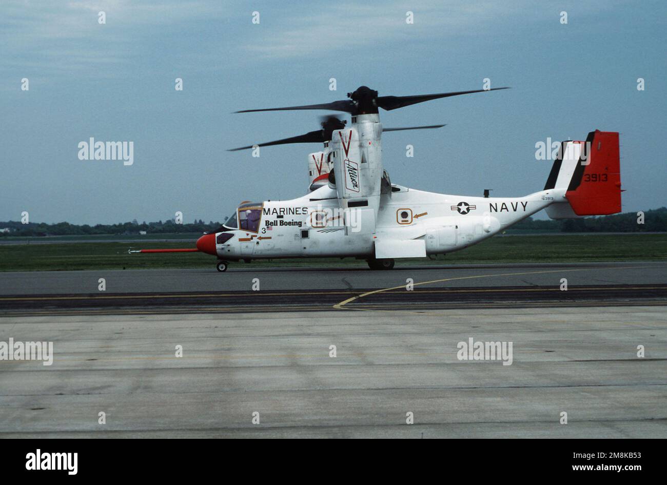 A left side view of a V-22 Osprey tilt-rotor test aircraft taxiing down ...