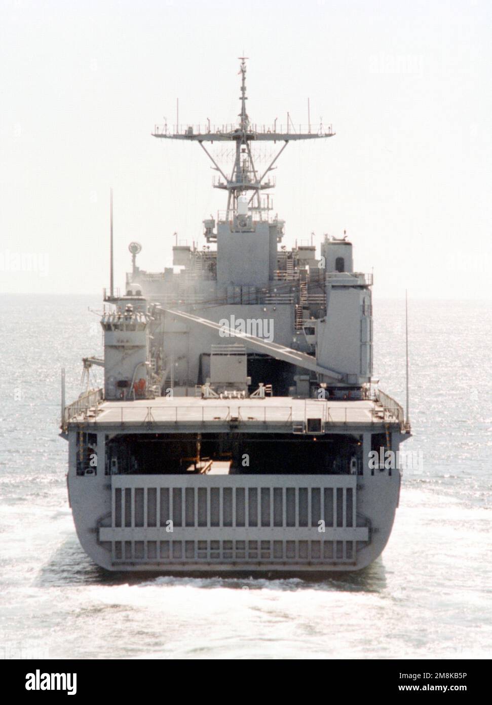 Low oblique stern-on view of the dock landing ship USS HARPERS FERRY ...