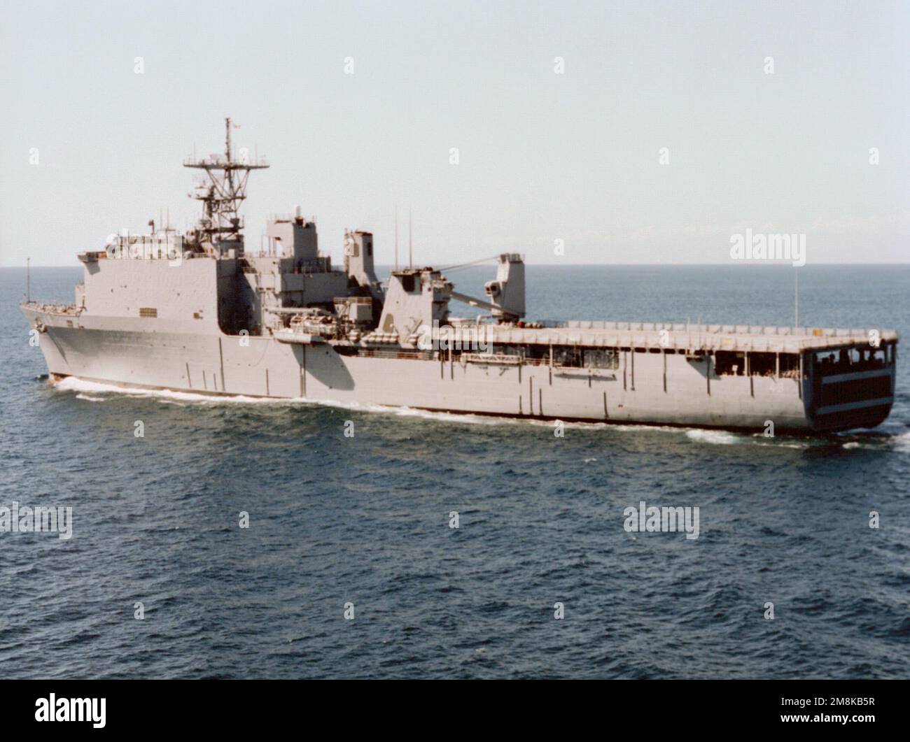 Low oblique port quarter view of the dock landing ship USS HARPERS ...
