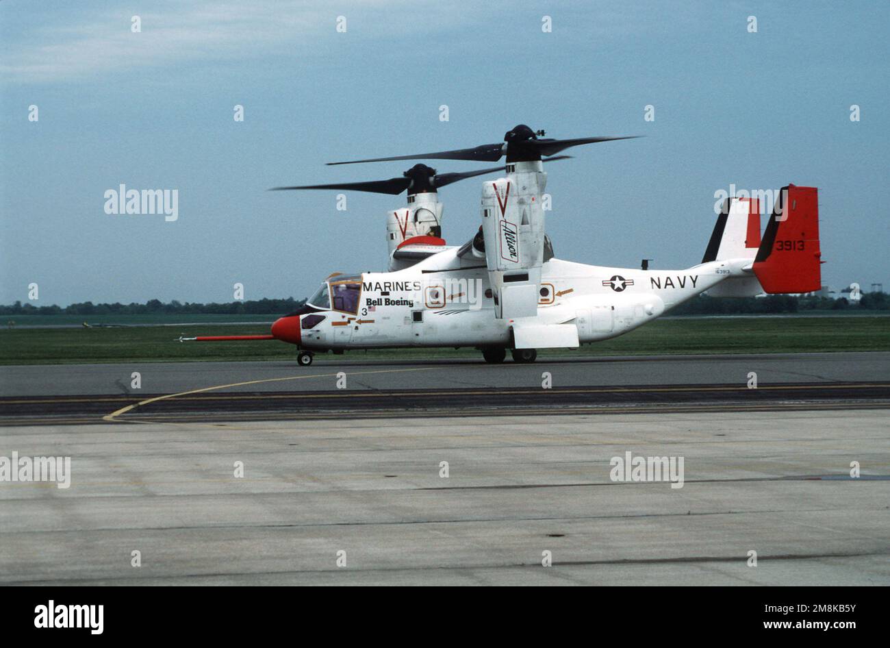 A right side view of a V-22 Osprey tilt-rotor test aircraft taxiing on ...
