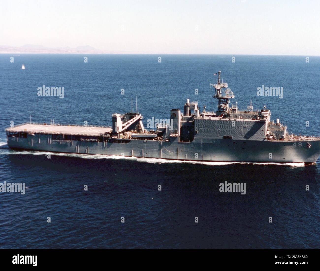 Low oblique starboard beam view of the dock landing ship USS HARPERS ...