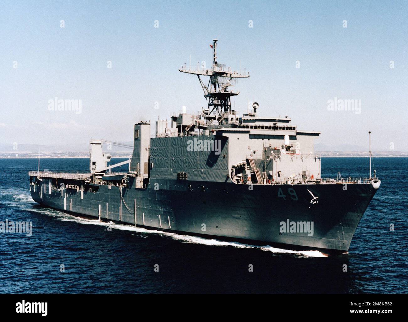 Low oblique starboard bow view of the dock landing ship USS HARPERS ...