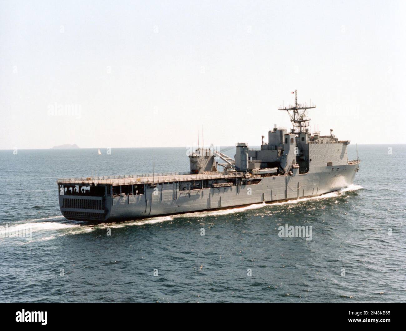 Low oblique starboard quarter view of the dock landing ship USS HARPERS ...