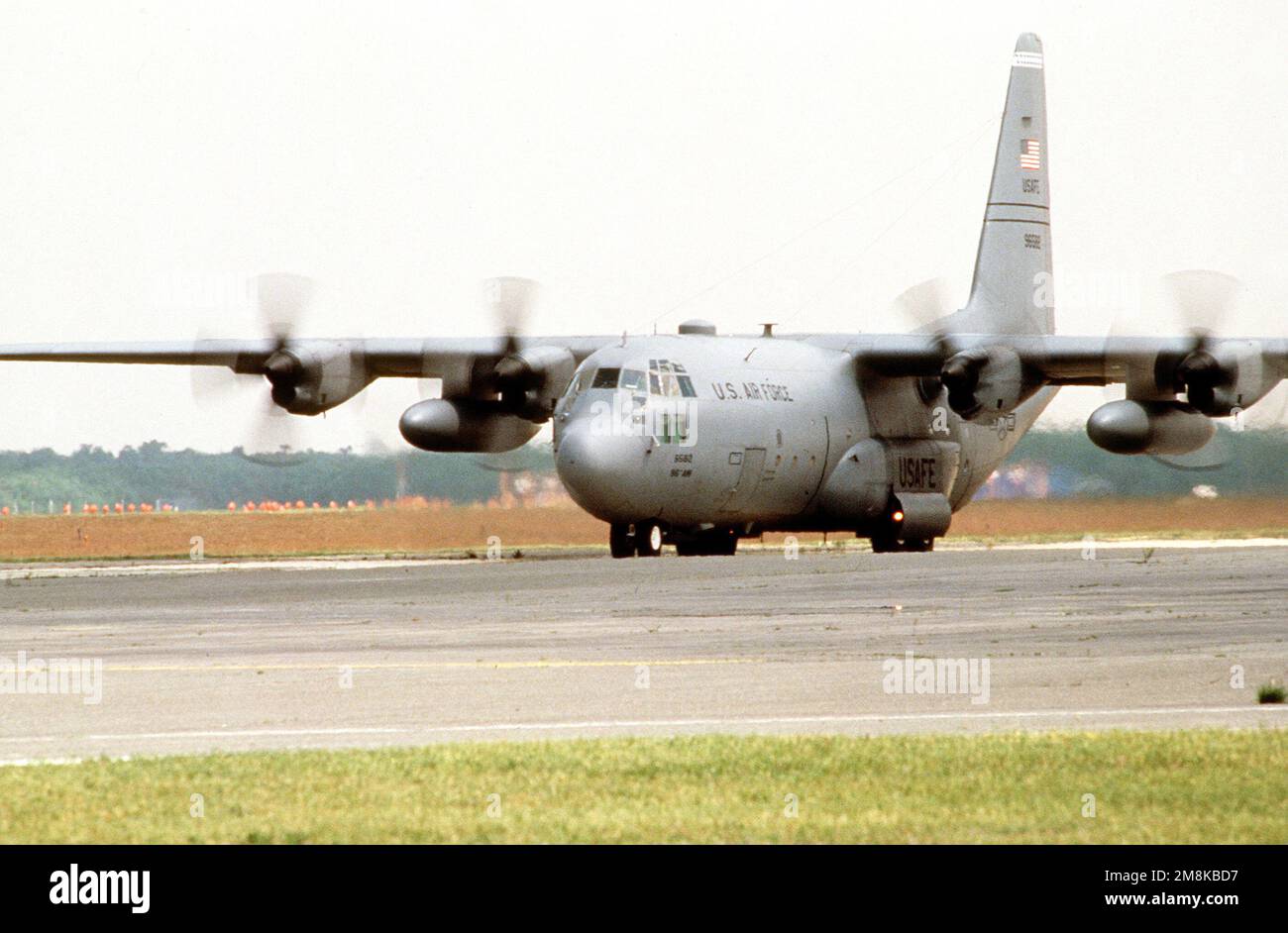 A US Air Force C-130 Hercules taxis to the runway for take off. The ...