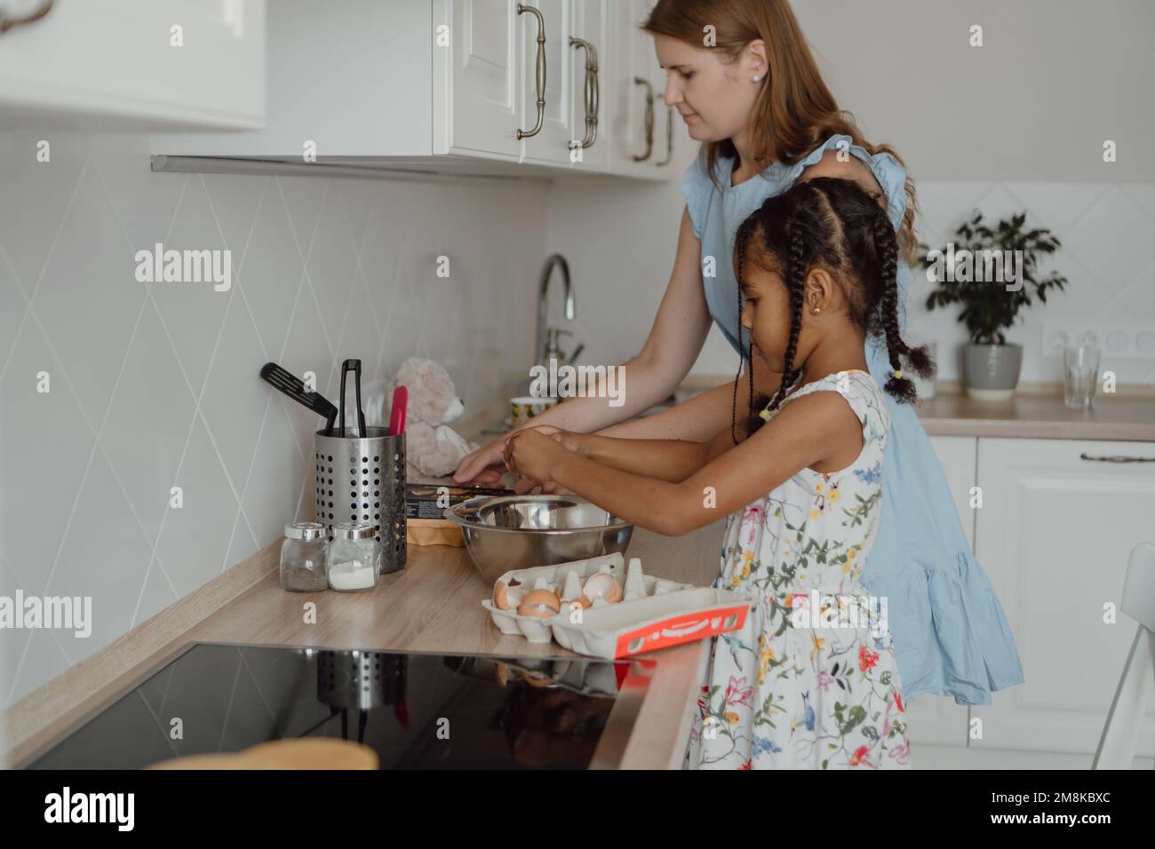 Hispanic mother cooking in kitchen hi-res stock photography and images ...