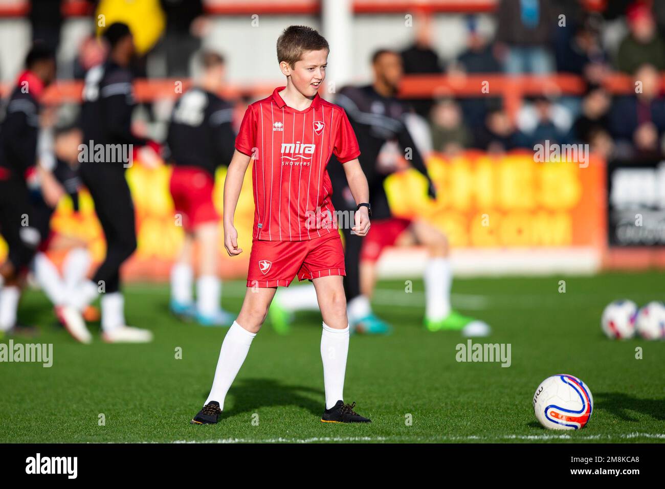Cheltenham, UK. 14th Jan, 2023. Cheltenham Town mascot during the warm ...