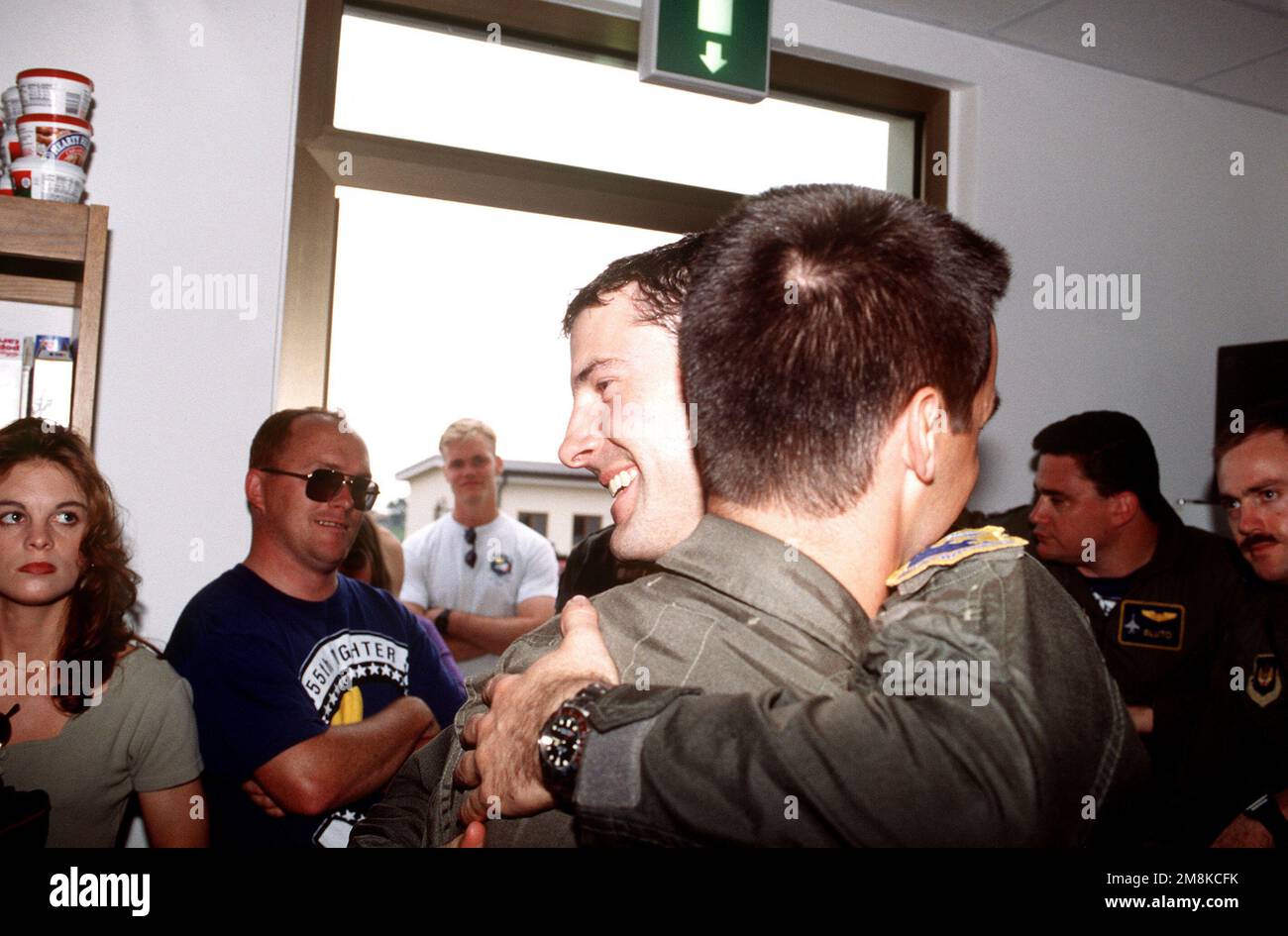 US Air Force CAPT. Scott F. O'Grady hugs a fellow pilot at the 555th ...