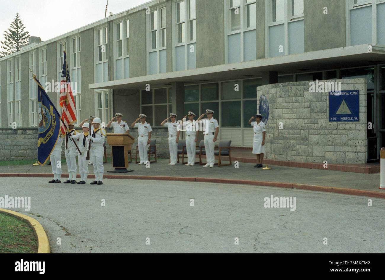 An honor guard is shown parading the colors during the decommissioning ...