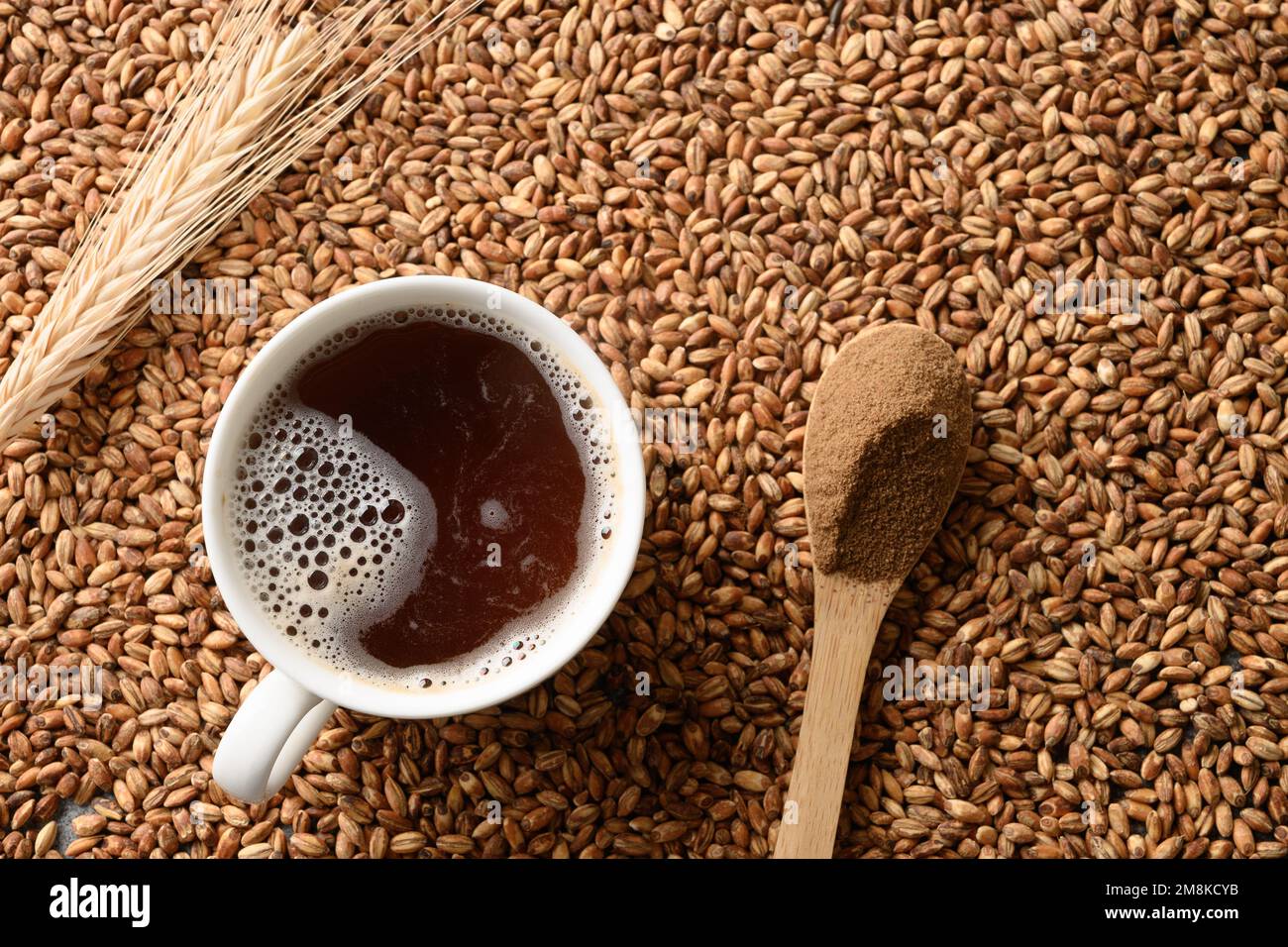 Barley coffee in white cup on background of beans. Alternative caffeine ...