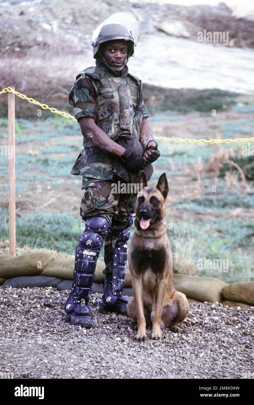 US Air Force Security Policeman AIRMAN Oswald stands with his guard dog ...