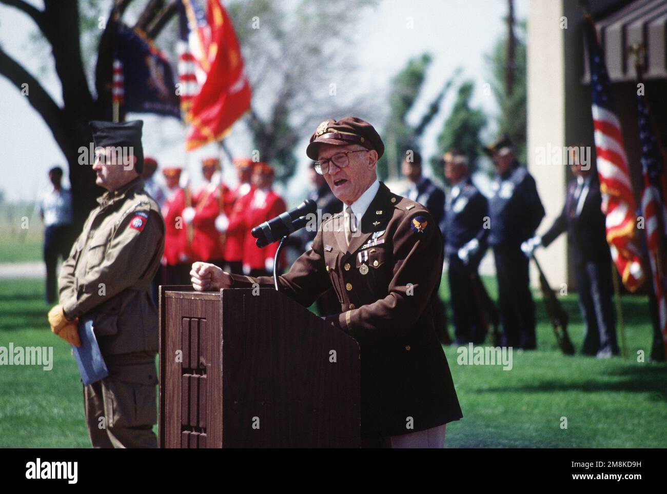 Mr. Leonard Kovar speaks during the ceremony as MASTER Sergeant Michael ...